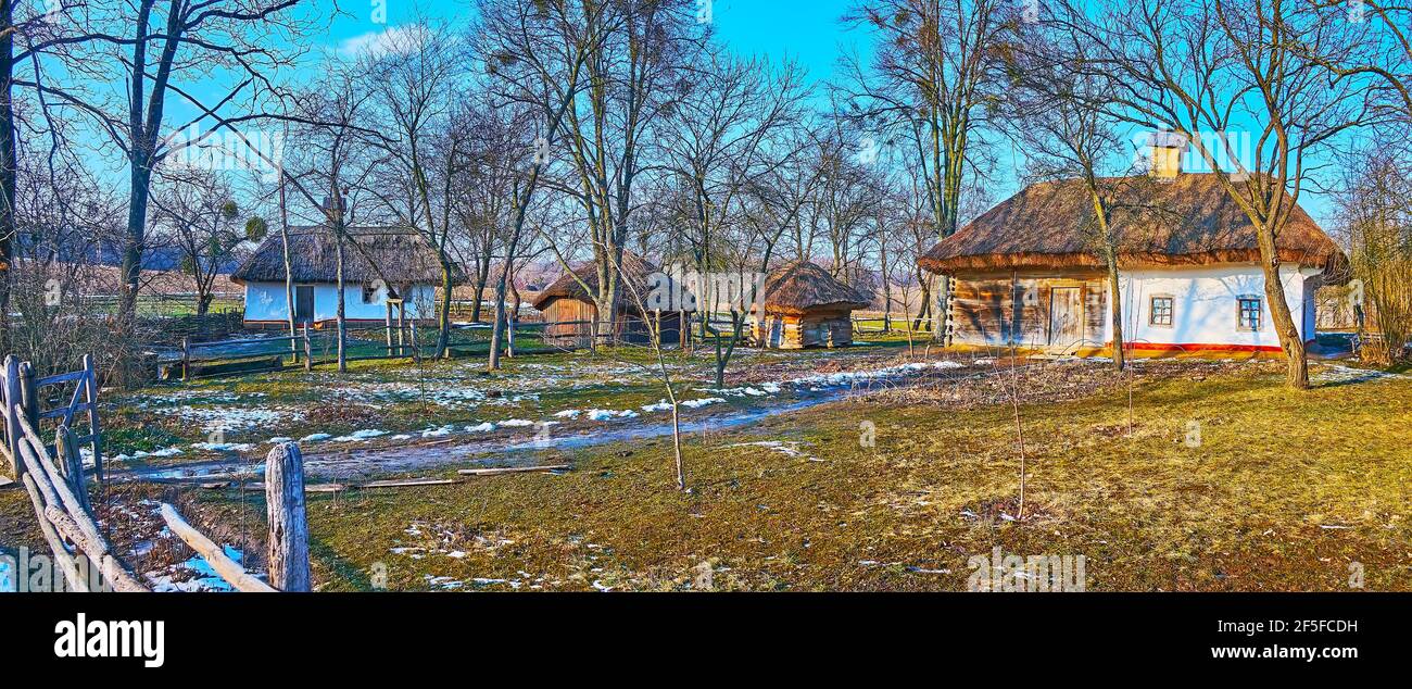 Panorama of historic farmstead with a barn, playpen and whitewashed ...