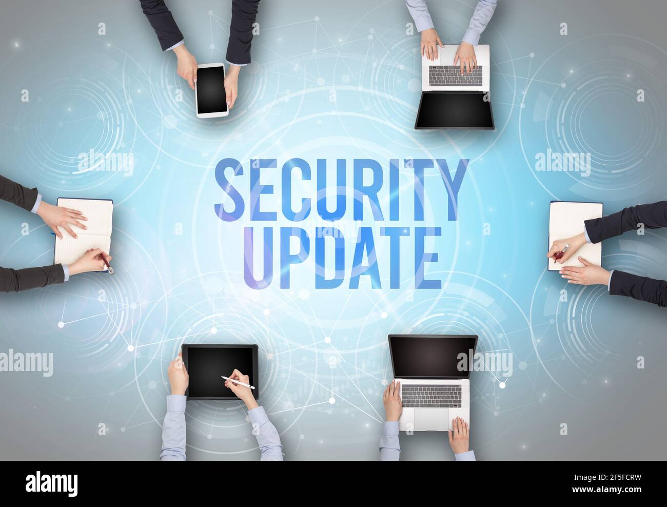 Group of people in front of a laptop, security concept Stock Photo - Alamy