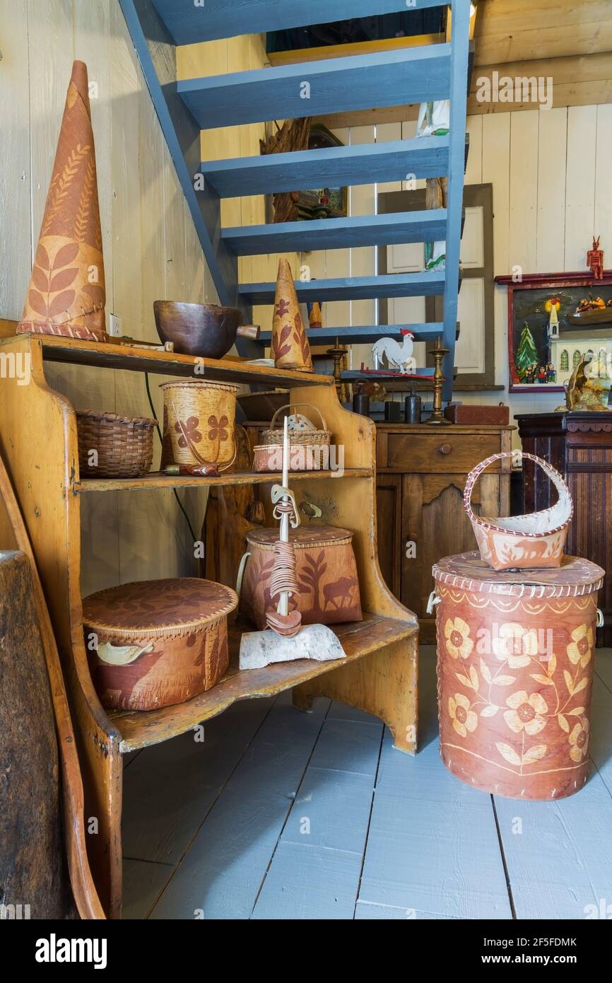 Native-made tree bark baskets and objects on display inside an old wood ...