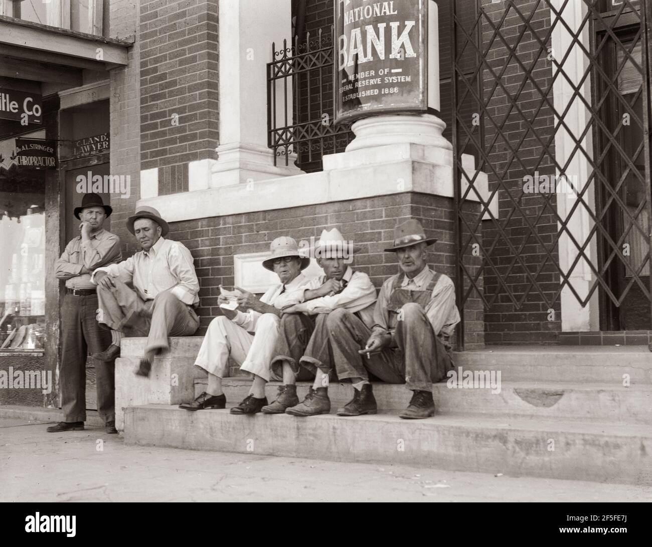 On the steps of the bank in the public square. Memphis, Texas. June ...