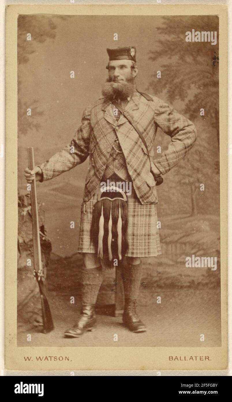 Unidentified bearded Scottish man wearing a kilt, holding a rifle ...