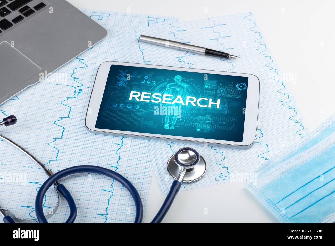 Tablet pc and doctor tools Stock Photo - Alamy