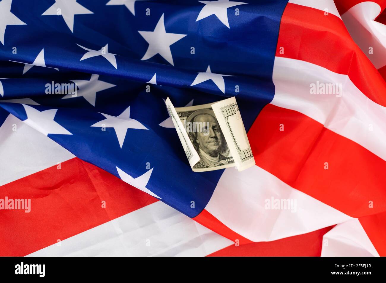 American dollar on the American flag Stock Photo - Alamy