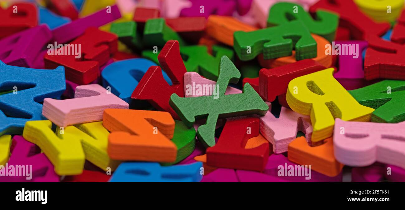 Colorful wooden letters in a close-up Stock Photo - Alamy