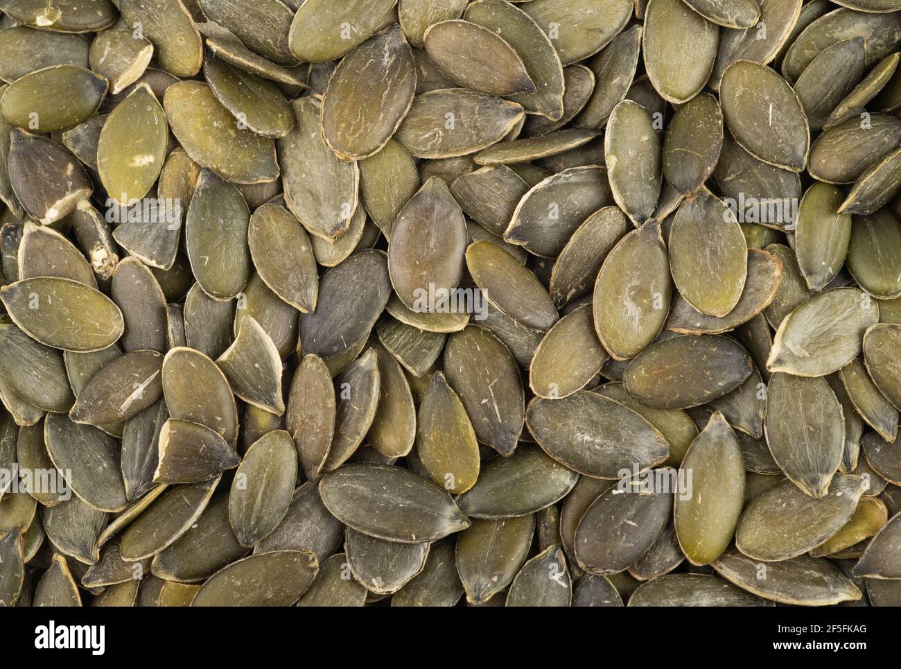 Top closeup view of squash seeds. Food backdrop Stock Photo - Alamy