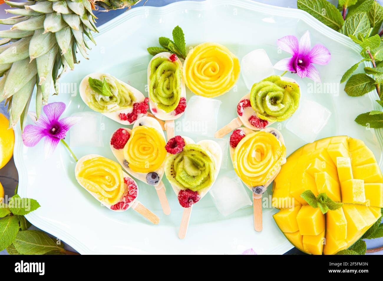 Homemade frozen popsicles with exotic fruits and coconut milk Stock ...