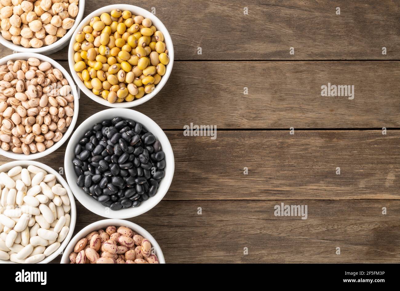 Assorted beans on white bowls with copy space Stock Photo - Alamy