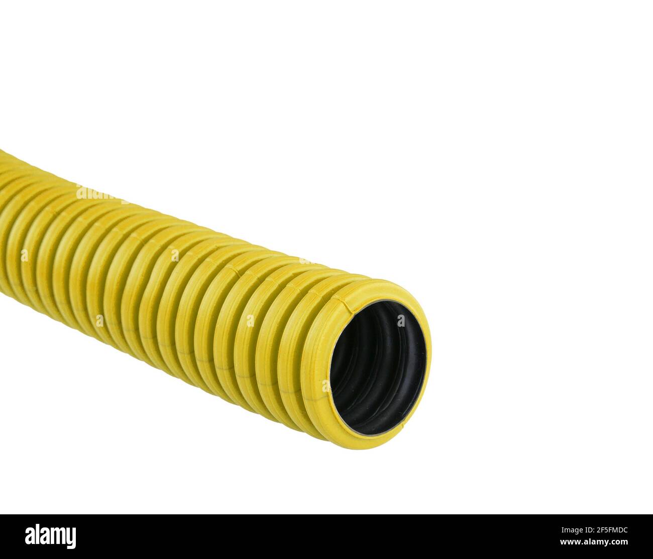 Closeup shot of a yellow corrugated pipe isolated on a white background ...