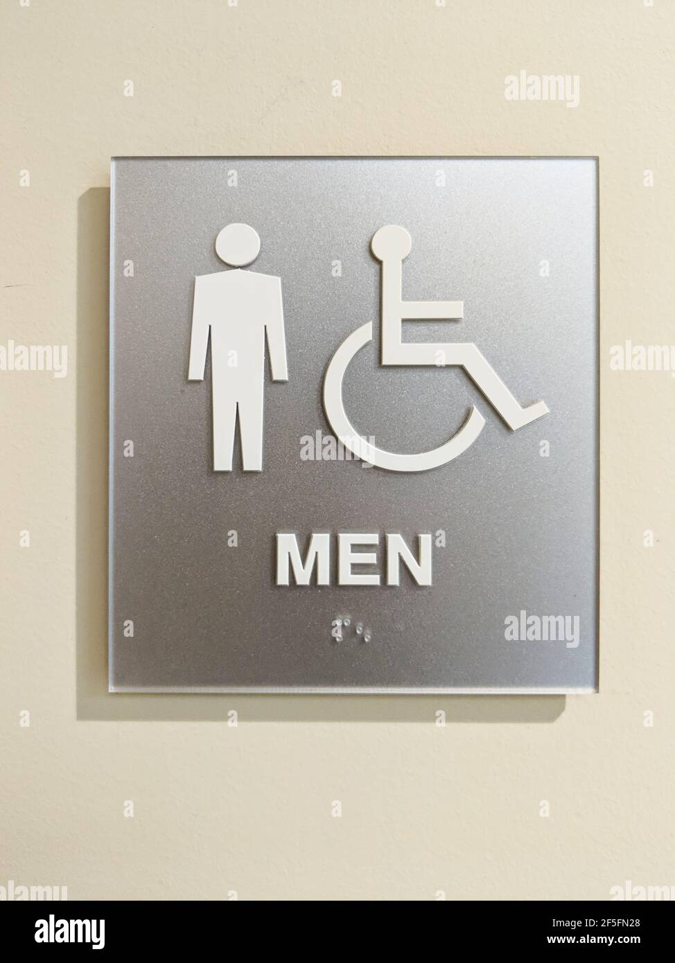 Mens ADA accessible bathroom sign with braille on wall Stock Photo - Alamy