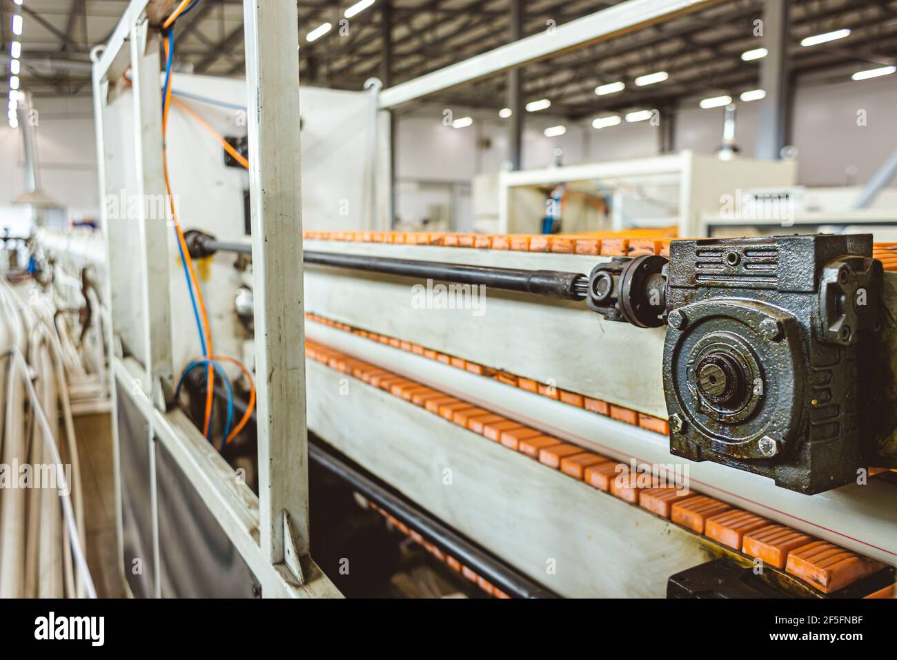 Workshop with extruders for producing plastic pipes. High speed ...