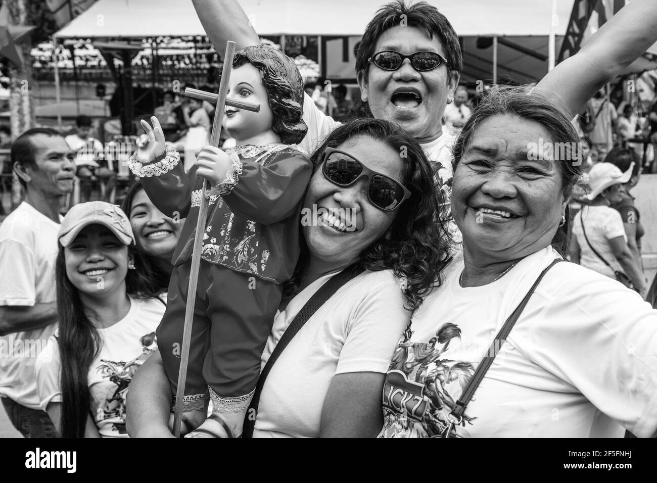 Local People Parade Their Santo Nino Statues Around The Streets Of Kalibo During The Ati Atihan