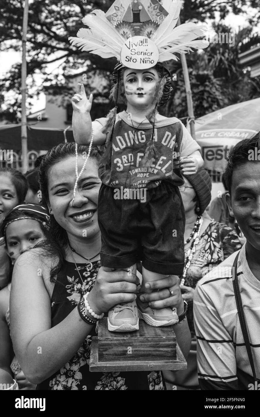 Local People Parade Their Santo Nino Statues Around The Streets Of ...