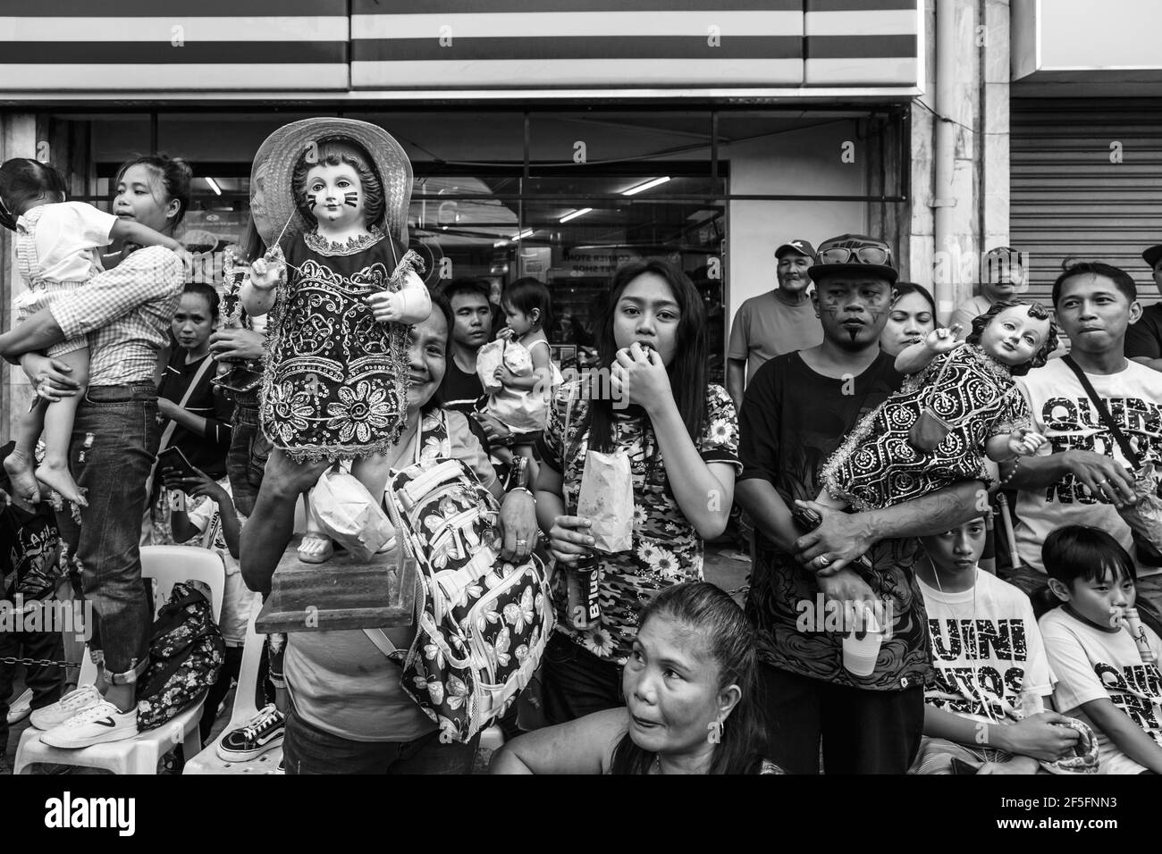 Local People Parade Their Santo Nino Statues Around The Streets Of ...