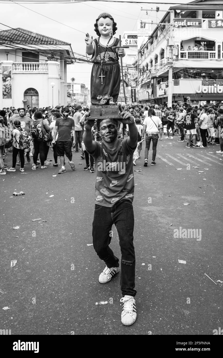 Local People Parade Their Santo Nino Statues Around The Streets Of Kalibo During The Ati Atihan