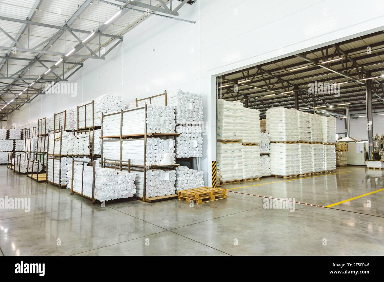 Spacious light interior of a large warehouse in a factory with special ...