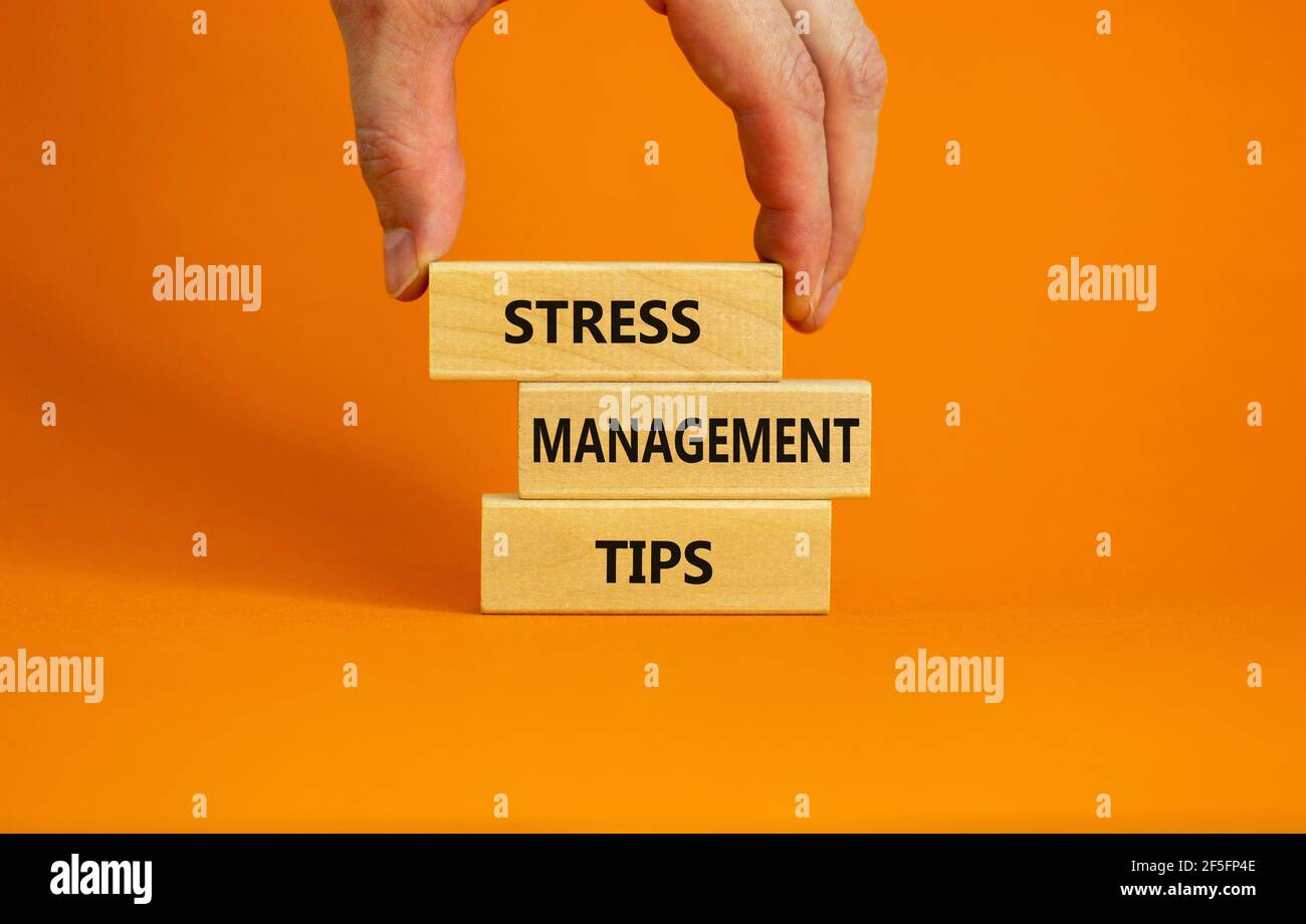 Stress management tips symbol. Wooden blocks with words 'Stress ...