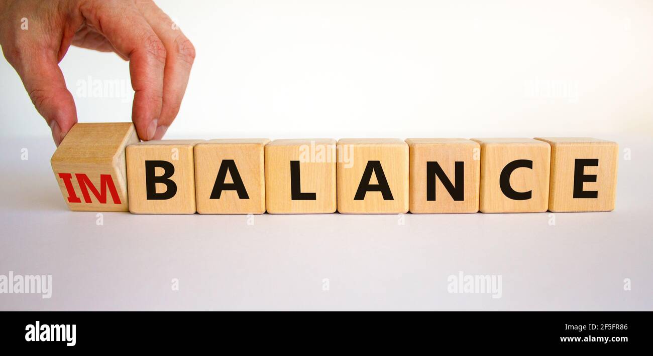 Balance or imbalance symbol. Businessman turns cubes and changes the ...