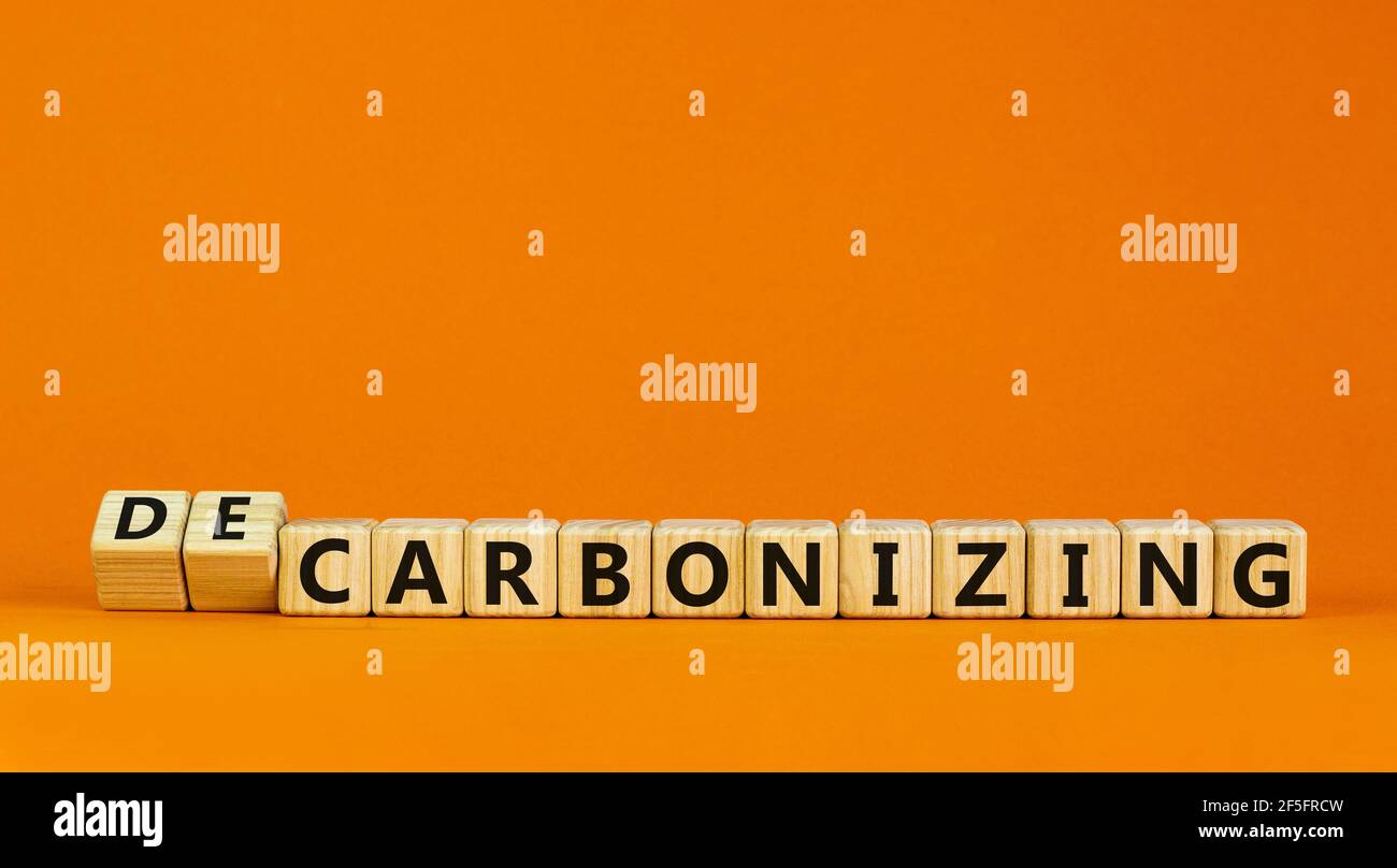 Carbonizing or decarbonizing symbol. Turned wooden cubes and changed ...