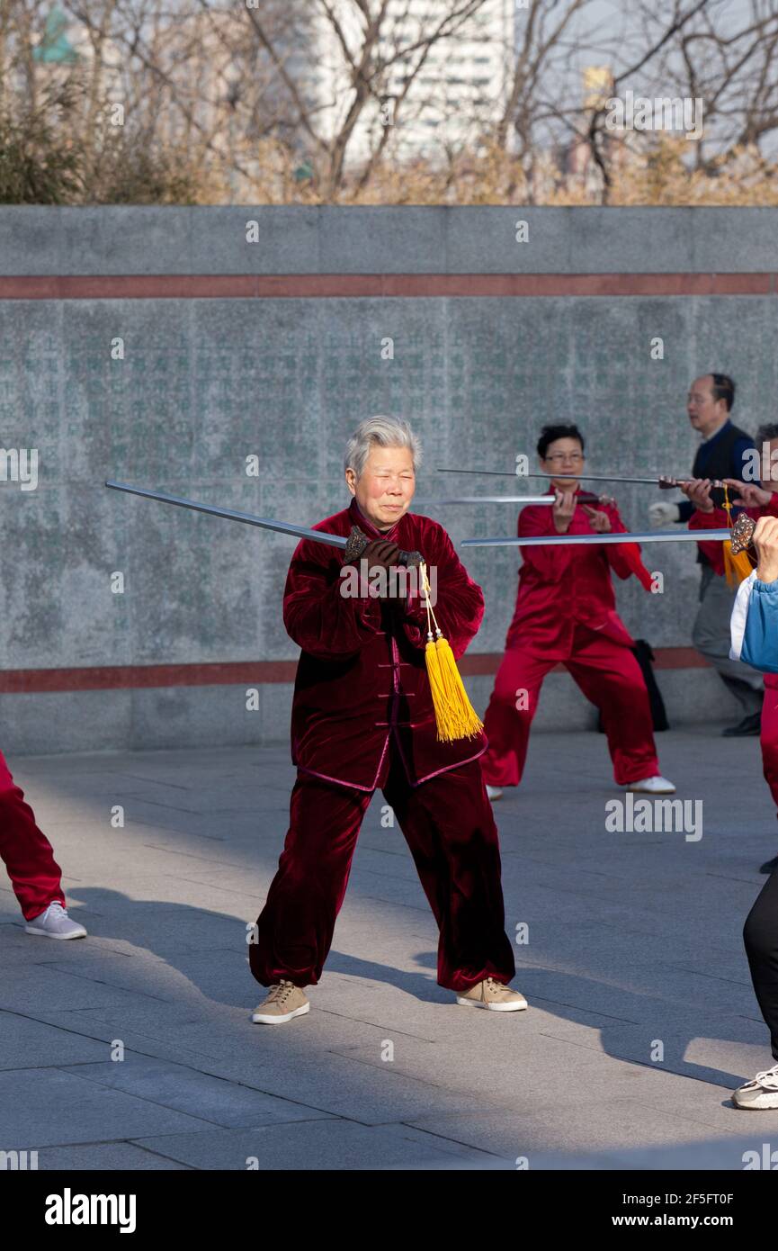 China Shanghai Early morning Tai Chi practitioners exercising on the ...