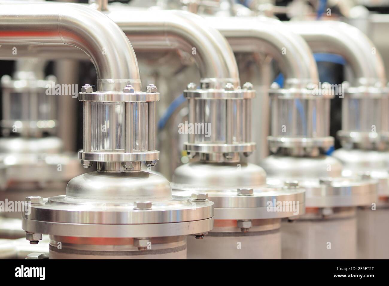 Industrial highly glossy stainless steel pipe connection on pipework ...