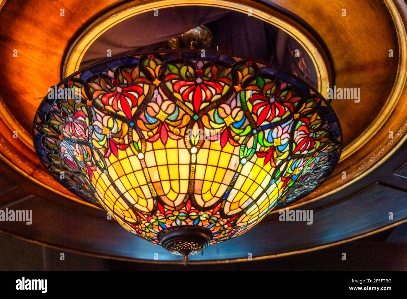 Luxury stained glass electric lamp in ceiling of Calle Ocho restaurant ...