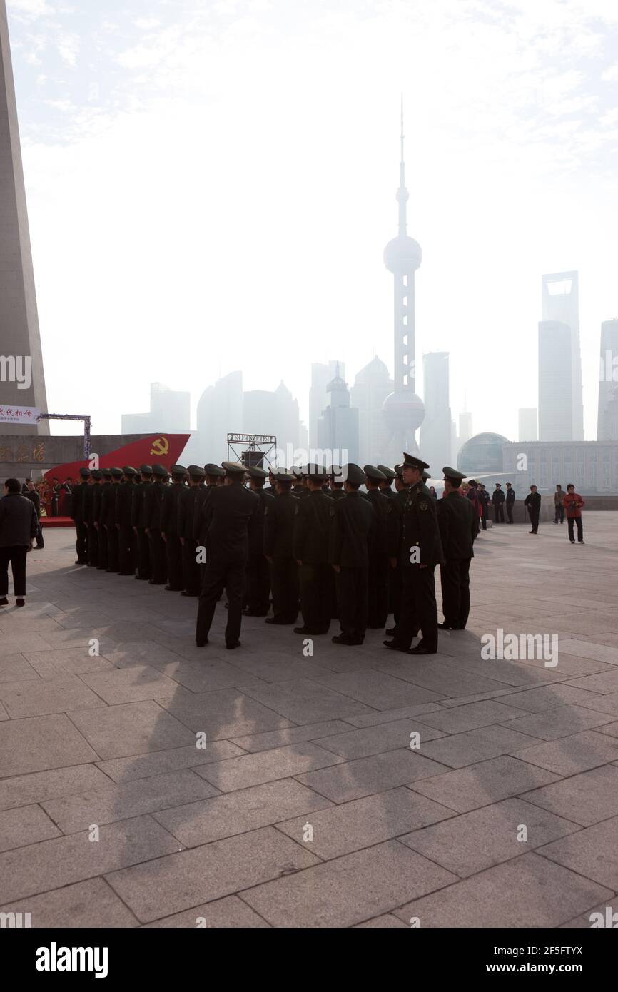 China Shanghai Military Ceremony on the Bund promenade with the skyline ...