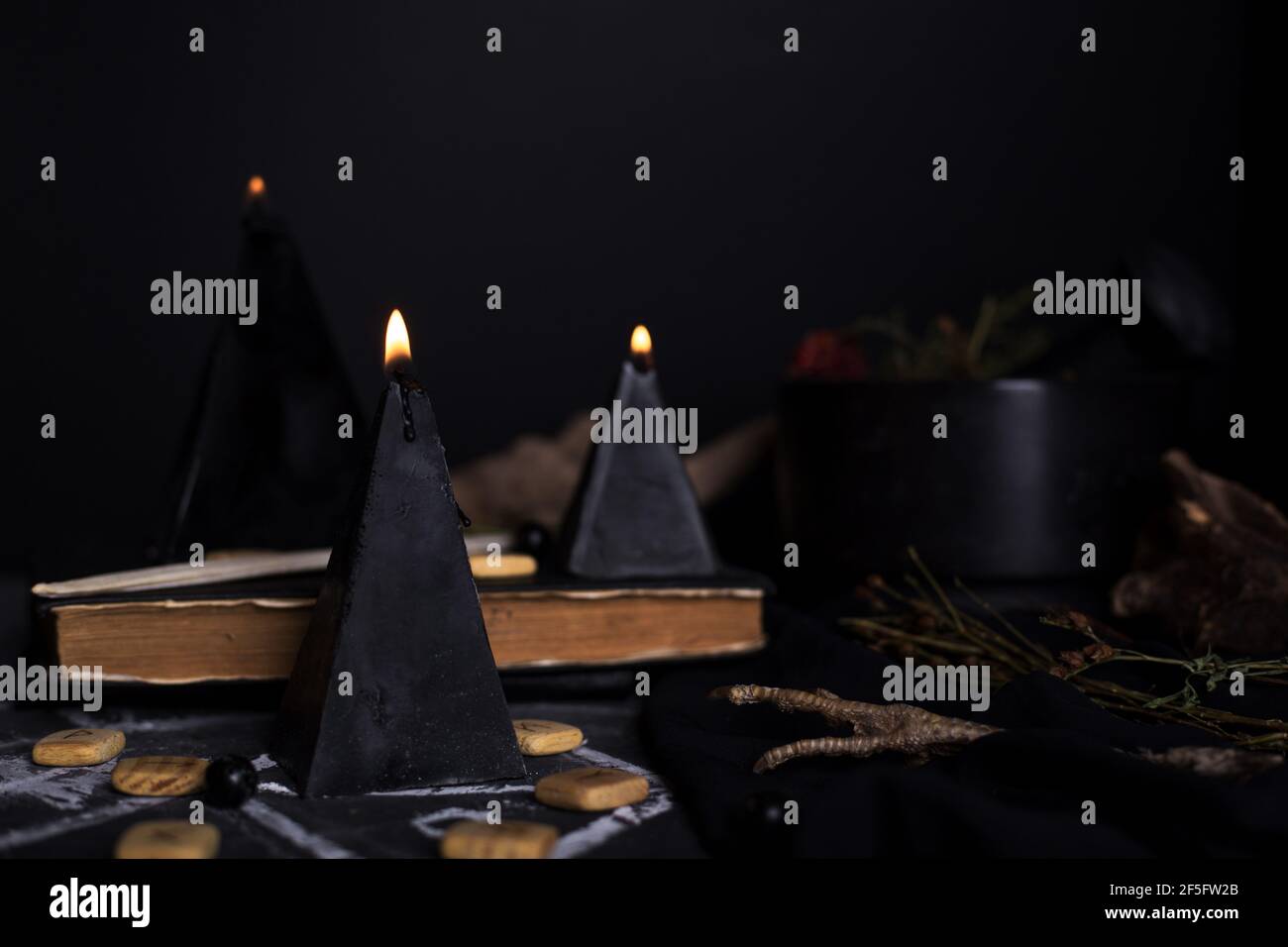 Still life with burning candles and pentagram circle background. Black ...