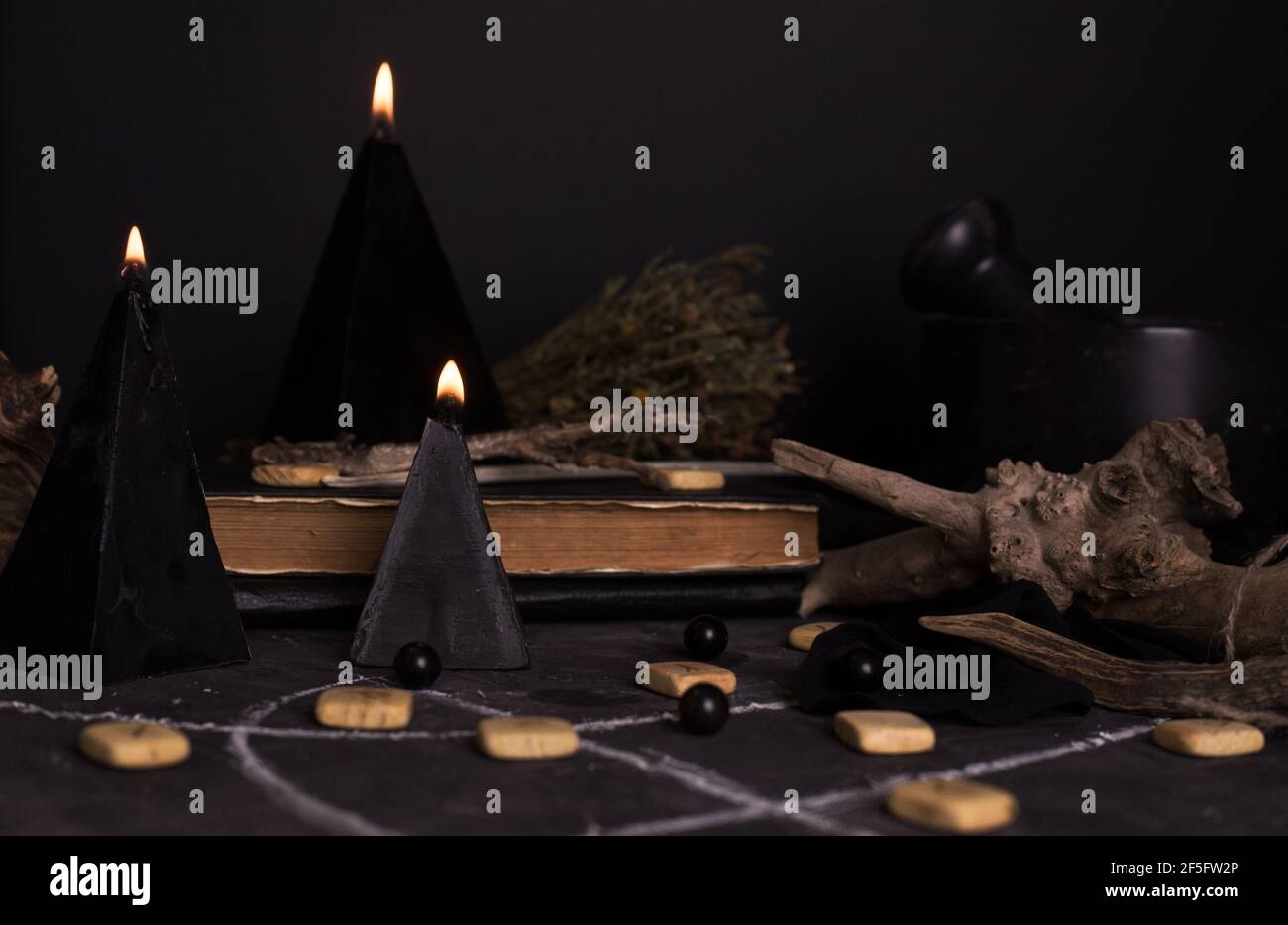 Still life with burning candles and pentagram circle background. Black ...