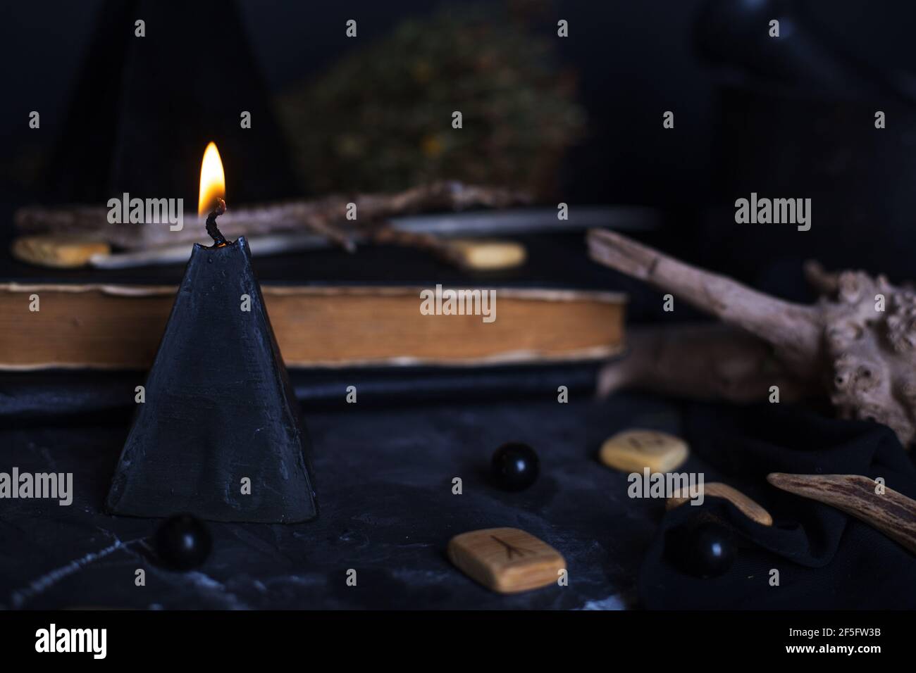 Still life with burning candles and pentagram circle background. Black ...