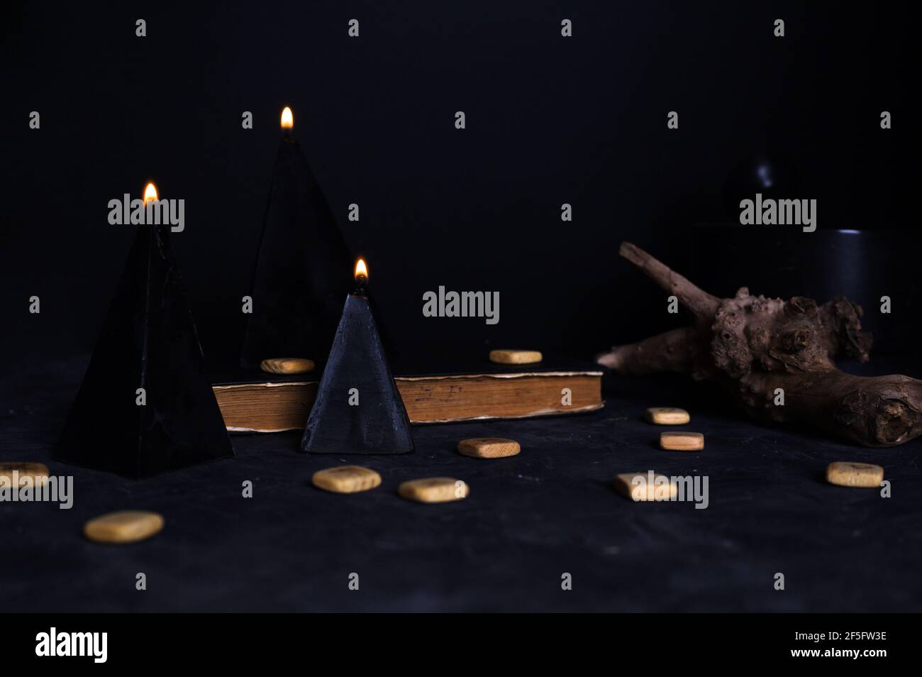 Still life with burning candles and pentagram circle background. Black ...