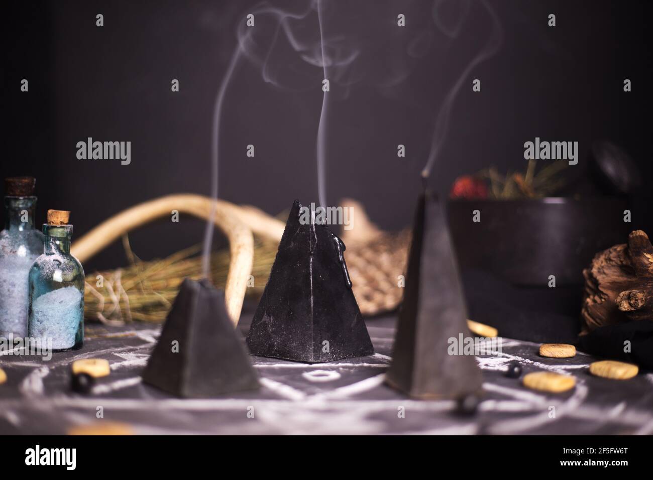 Still life with burning candles and pentagram circle background. Black ...