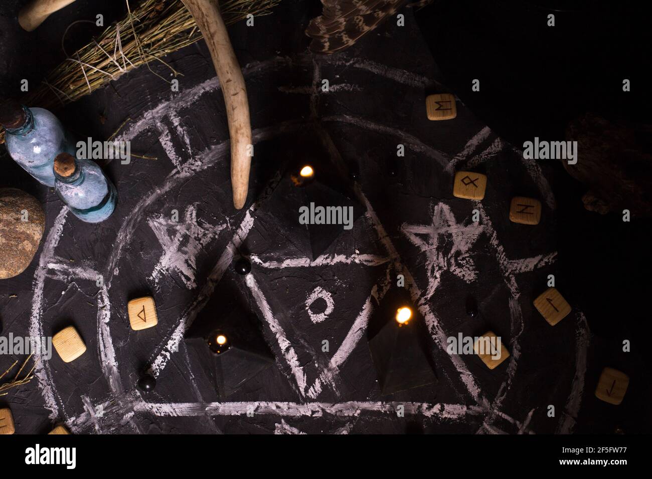 Still life with burning candles and pentagram circle background. Black ...