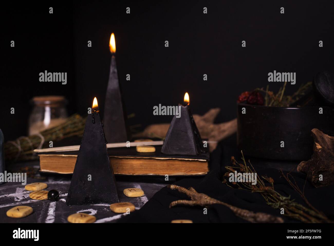 Still life with burning candles and pentagram circle background. Black ...