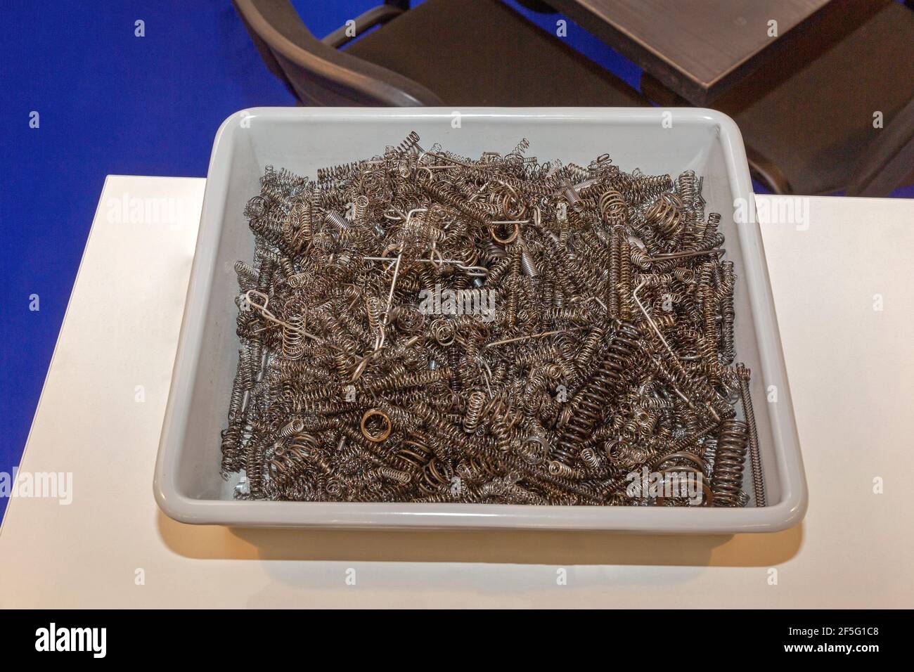 Many Metal Spring Coils Parts in Crate Stock Photo - Alamy