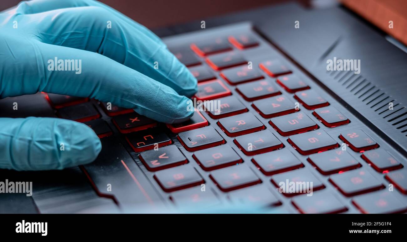 Computer keyboard hands gloves typing hi-res stock photography and ...