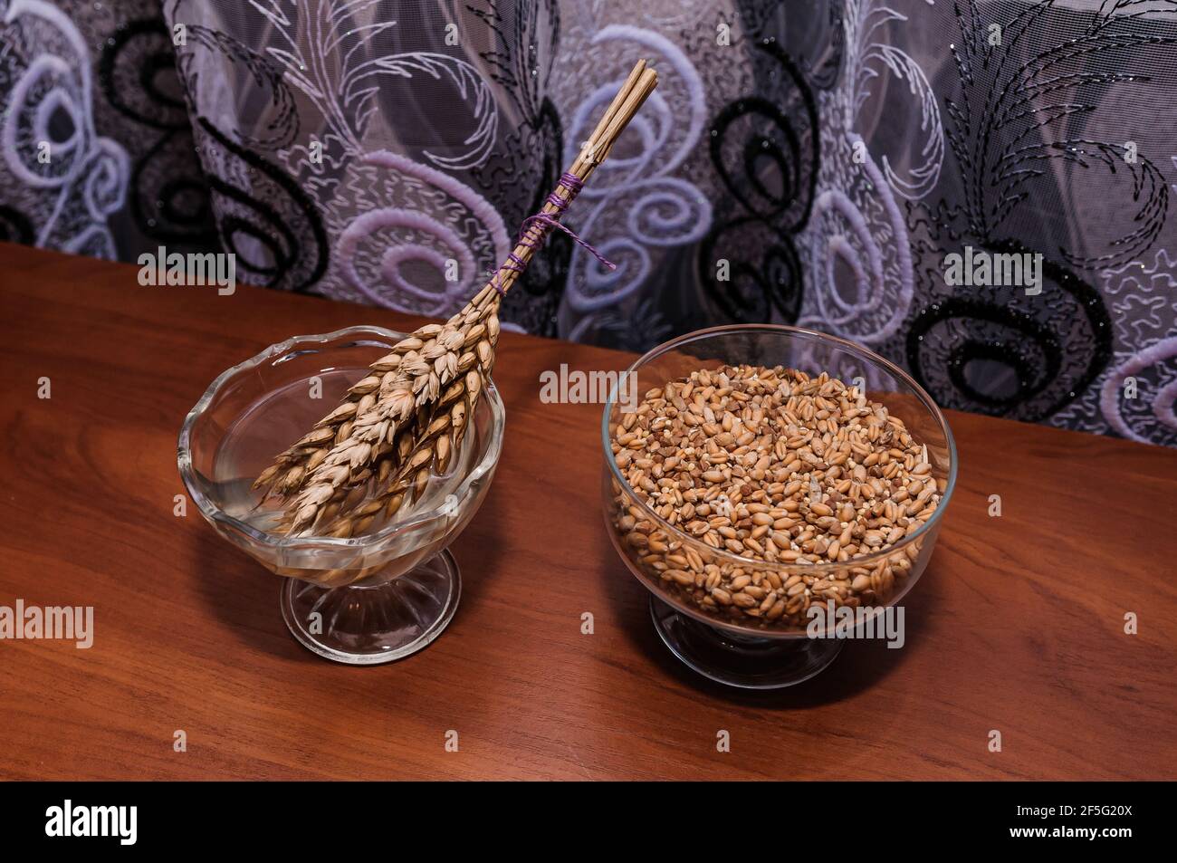 Wheat grains in a glass. Wheat ears in a glass Stock Photo - Alamy