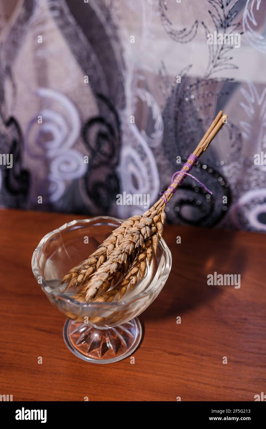 Wheat grains in a glass. Wheat ears in a glass Stock Photo - Alamy