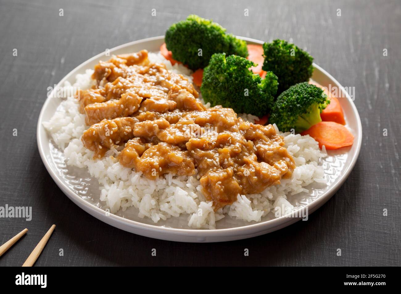 Homemade Orange Chicken with White Rice, Broccoli and Carrot on a plate ...