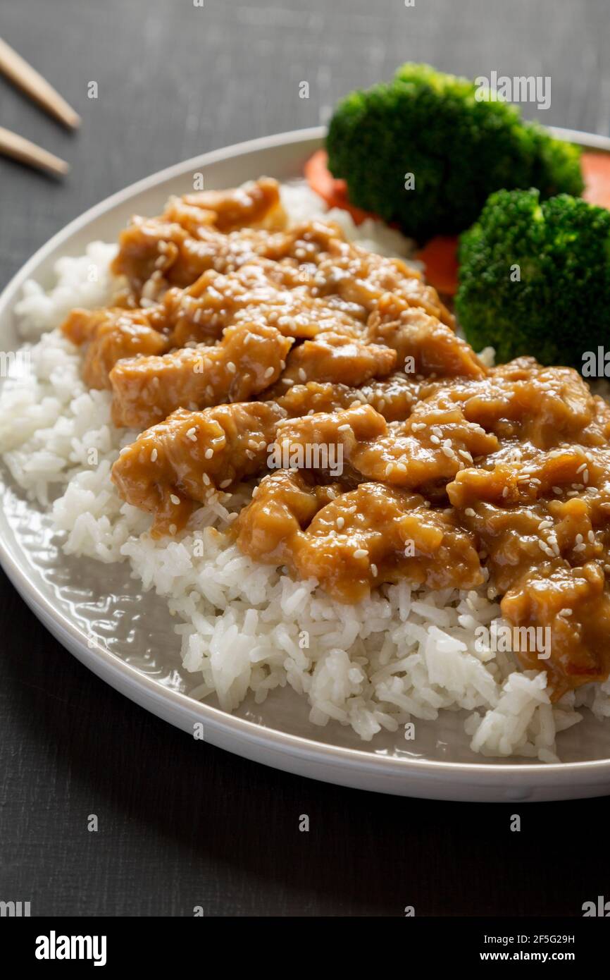 Homemade Orange Chicken with White Rice, Broccoli and Carrot on a plate ...
