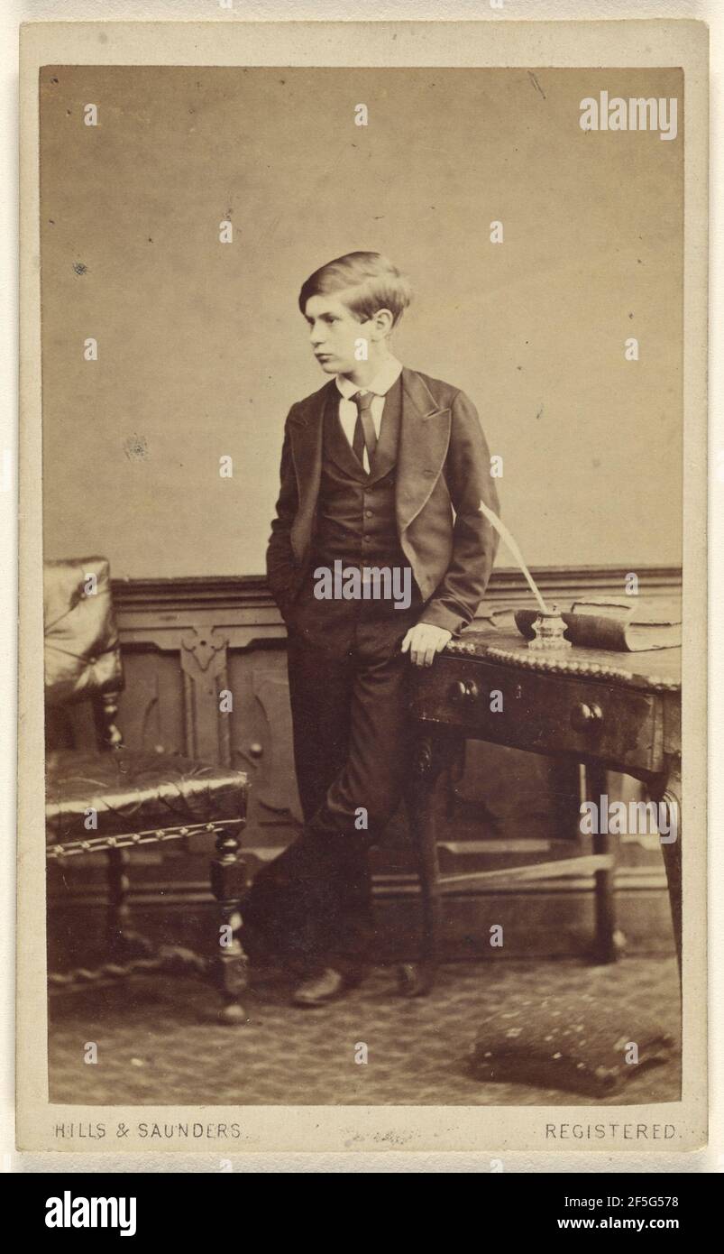 Unidentified well-dressed young boy, standing. Hills & Saunders ...