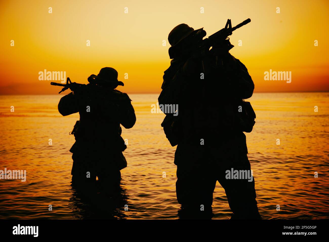 Two commando soldiers, army special operations fighters aiming assault ...