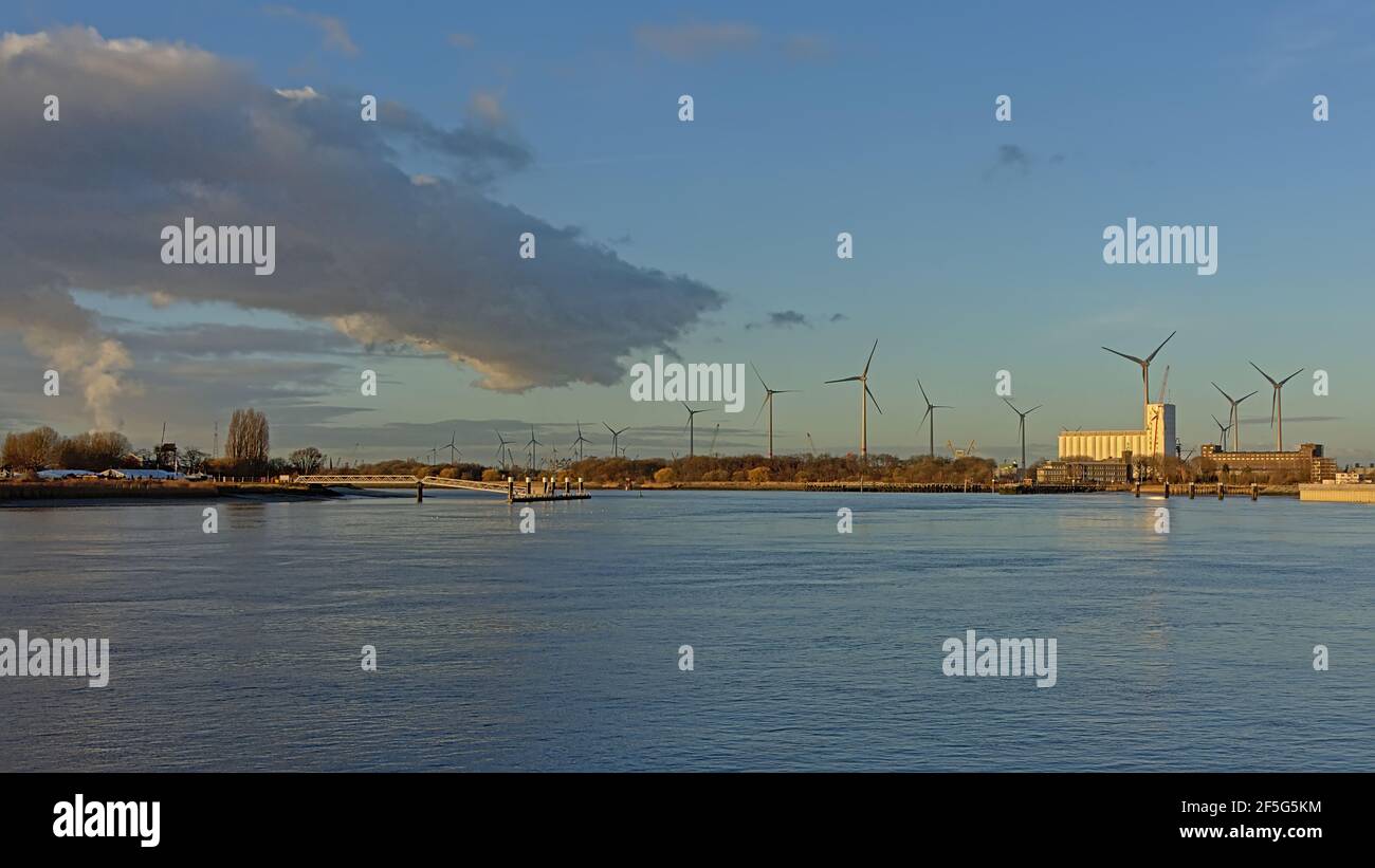 Dock in the port of Antwerp, Belgium, with old industrial buildings and ...