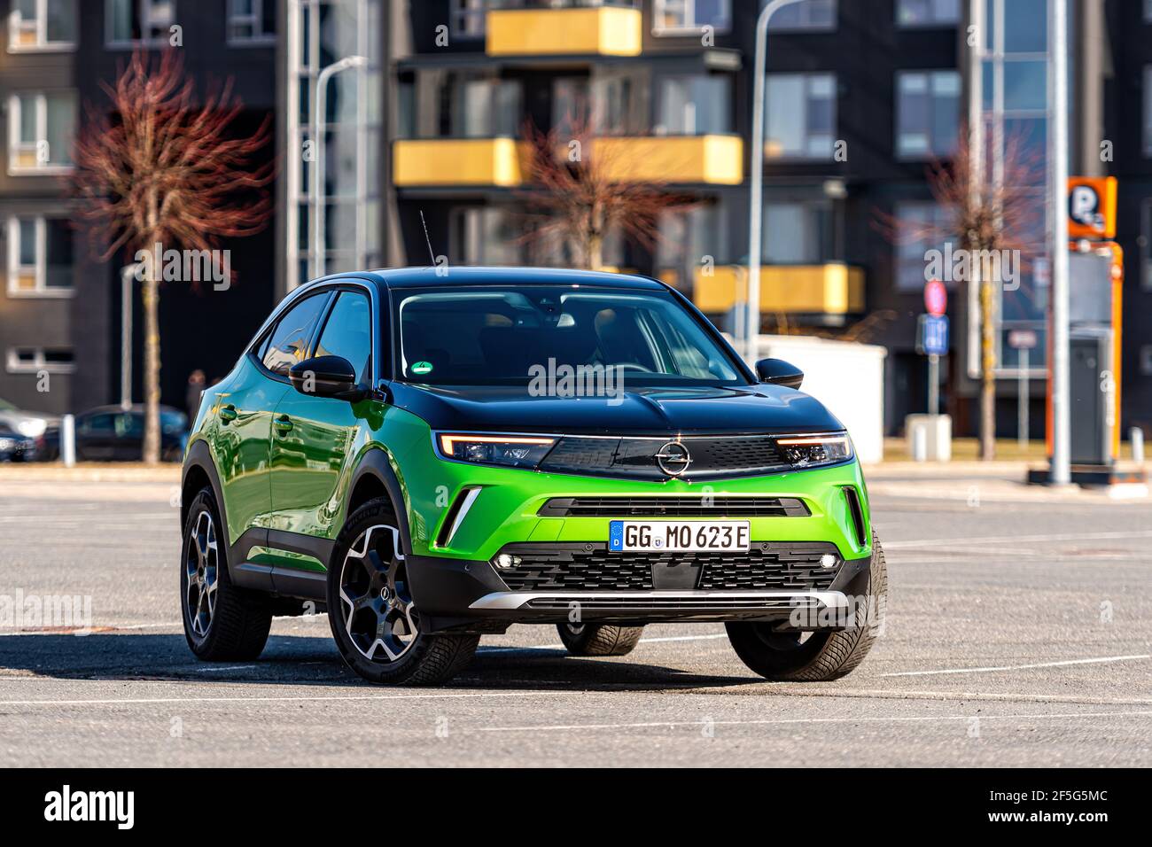 Riga, Latvia - 26 March, 2021: green electric vehicle Opel Mokka-e in ...