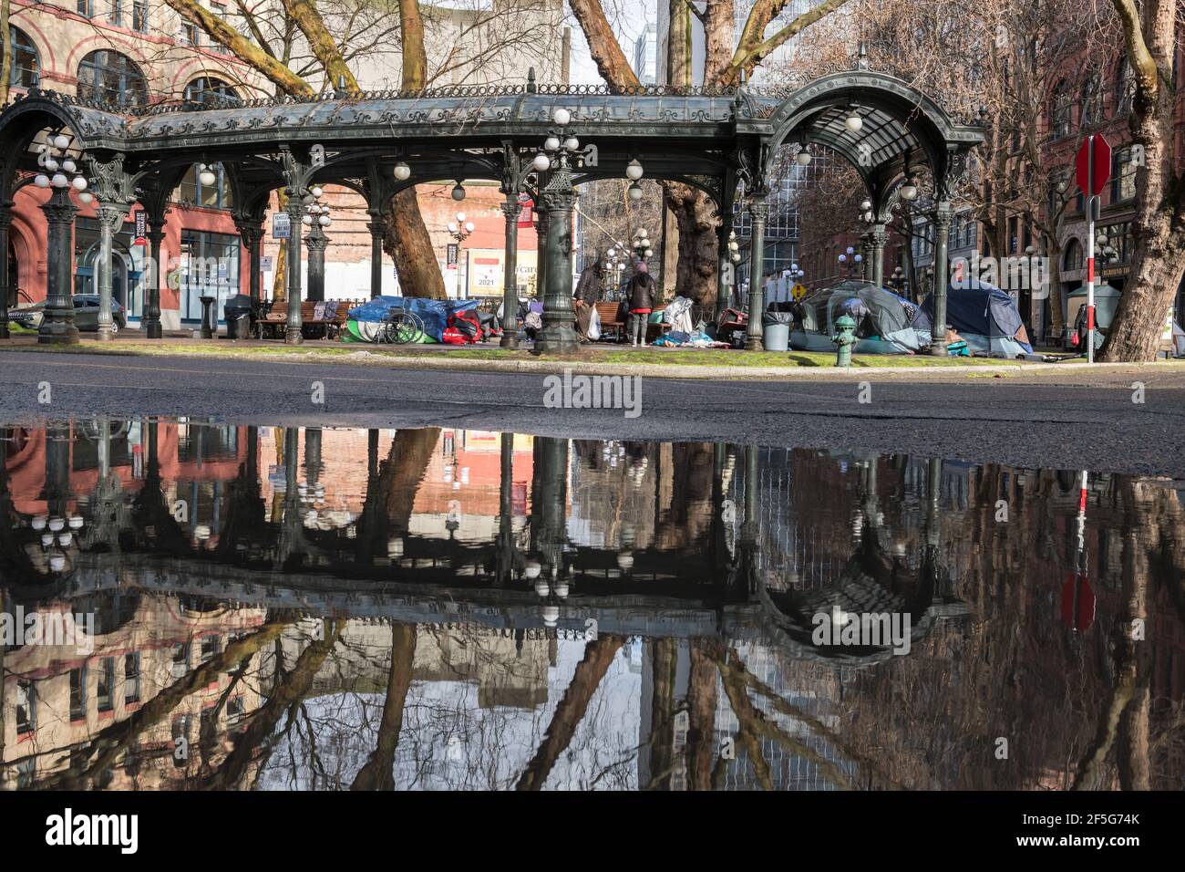 Seattle, USA. 22nd Mar, 2021. The historic pergola and homeless tents ...