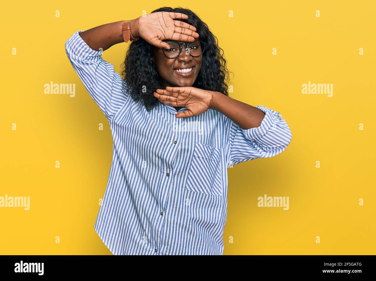Beautiful african young woman wearing casual clothes and glasses ...