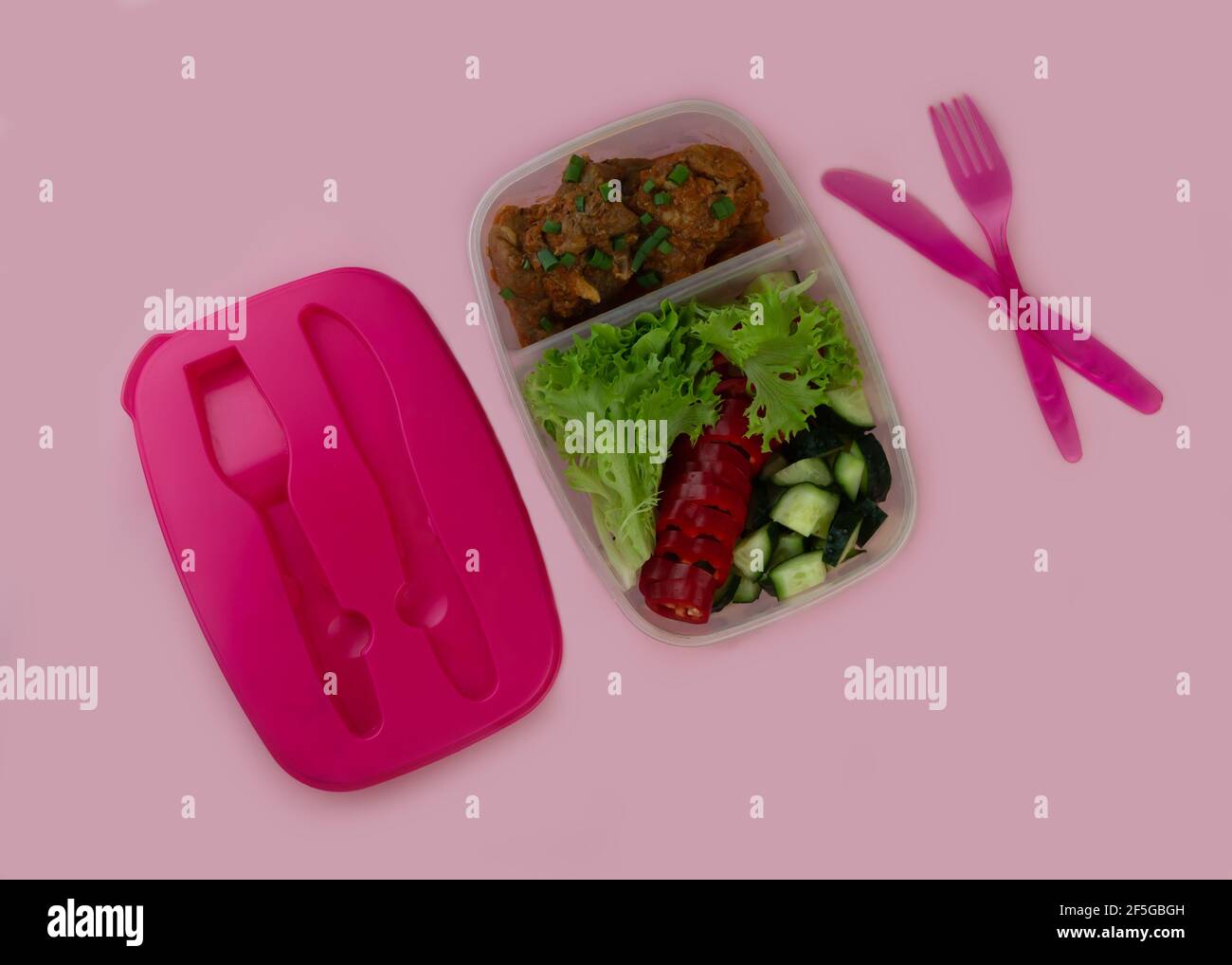 Container with salad, meat and orange. Homemade takeaway lunch Stock ...