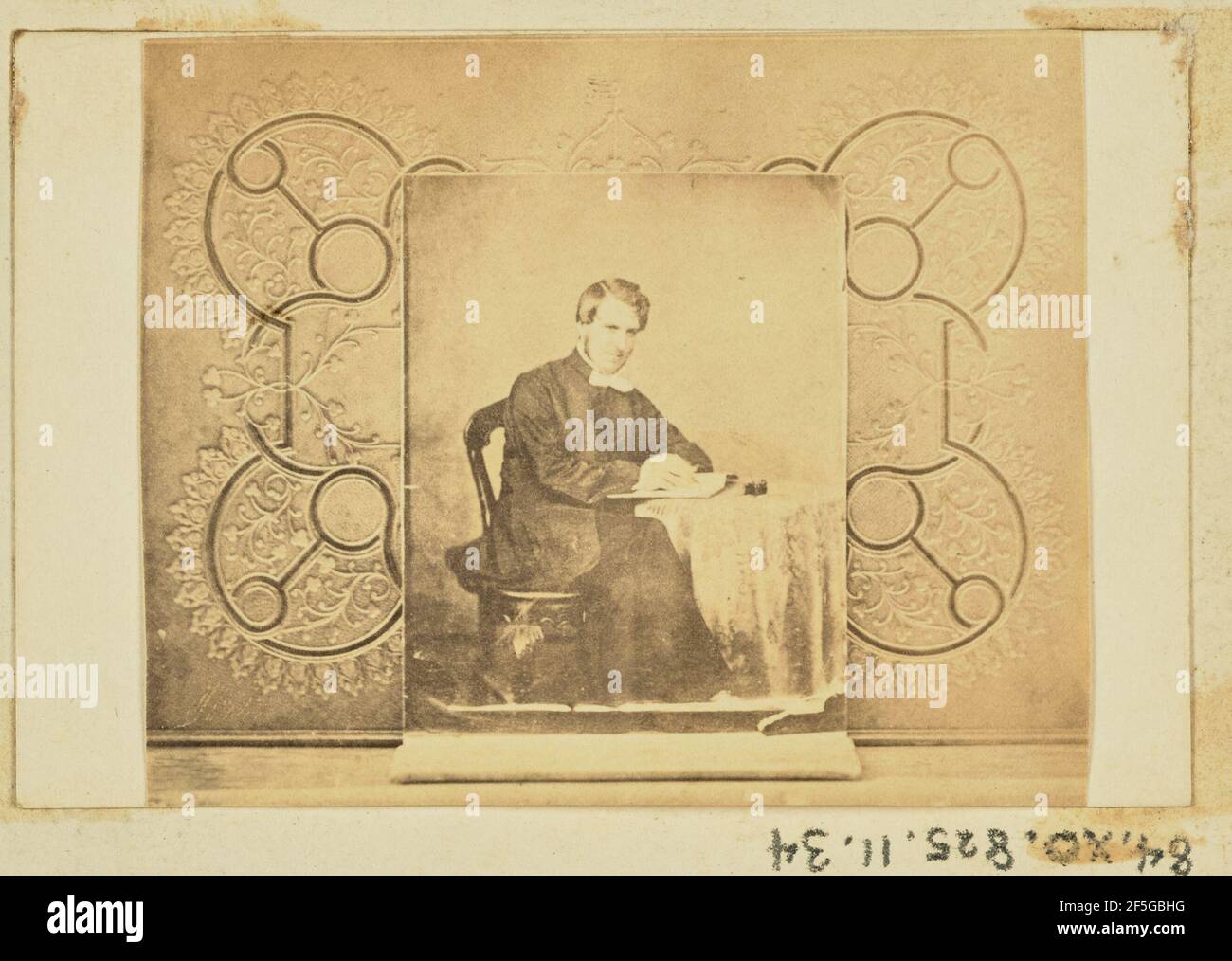 Portrait of a man seated at a table. Unknown maker Stock Photo - Alamy
