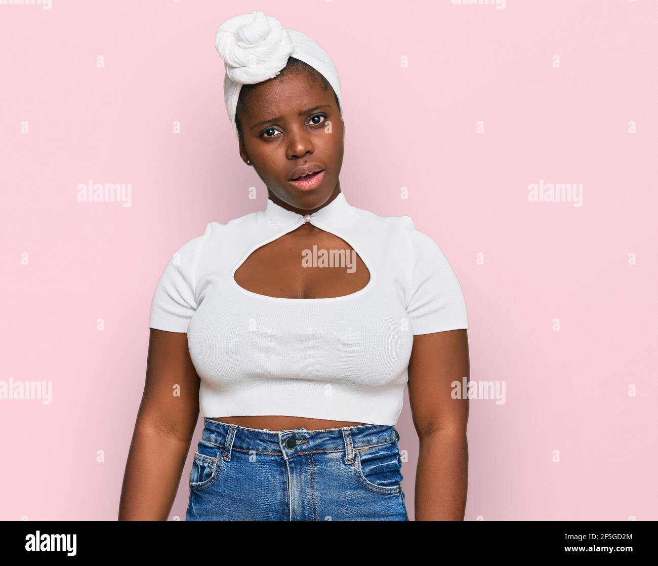 Young african woman with turban wearing hair turban over isolated ...
