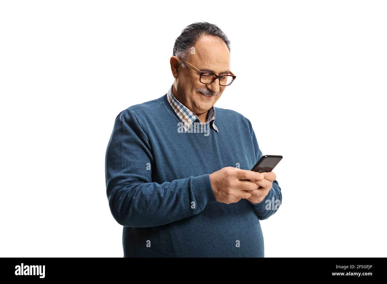 Smiling mature man typing on a mobile phone isolated on white ...