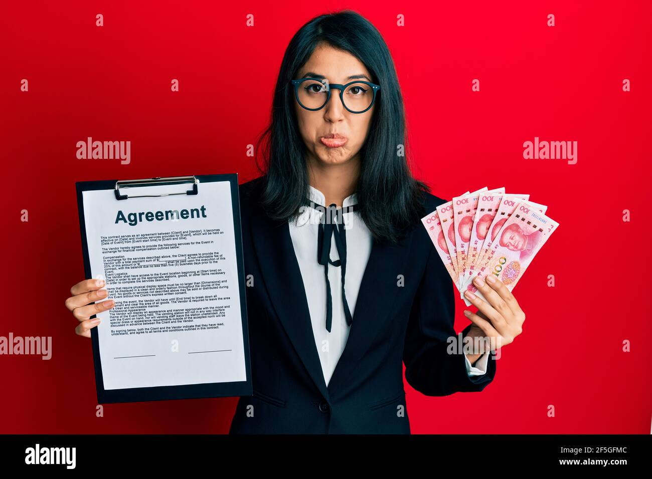 Beautiful asian young business woman holding agreement document and 100 ...